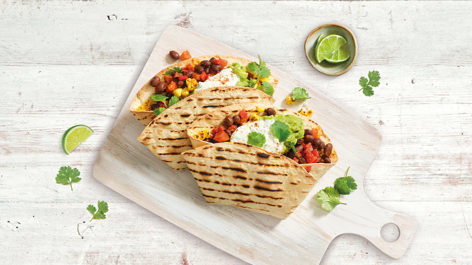 Chipotle Black Bean & Corn folded Tacos | Helgas